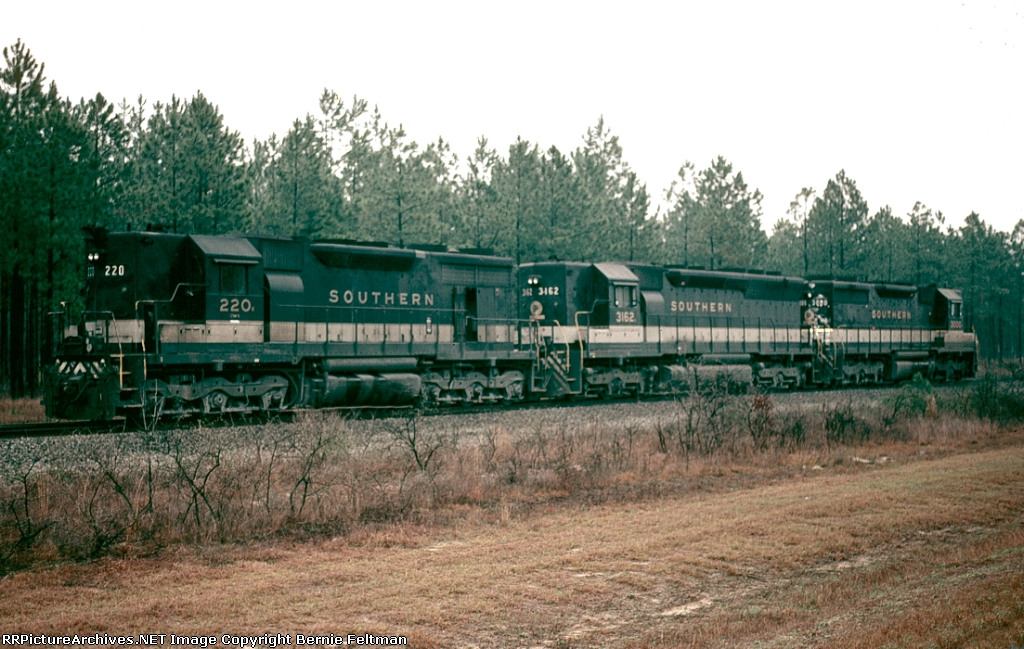 Southern Railway SD35 #220, SD45 #3162 and SD35 #3000 have cut off from their train and are at ...